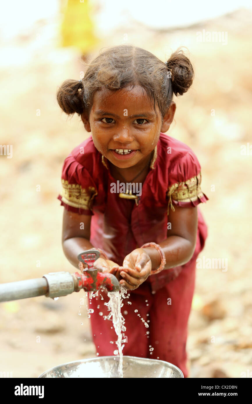 Indian kid washing hands hi-res stock photography and images - Alamy