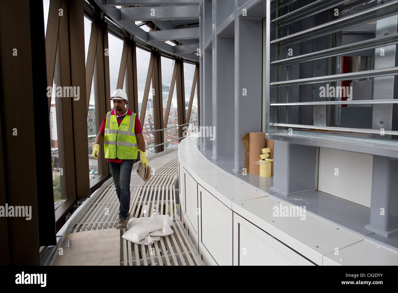 Finishing touches to Coop HQ Noma Manchester Pictured a workman walks ...