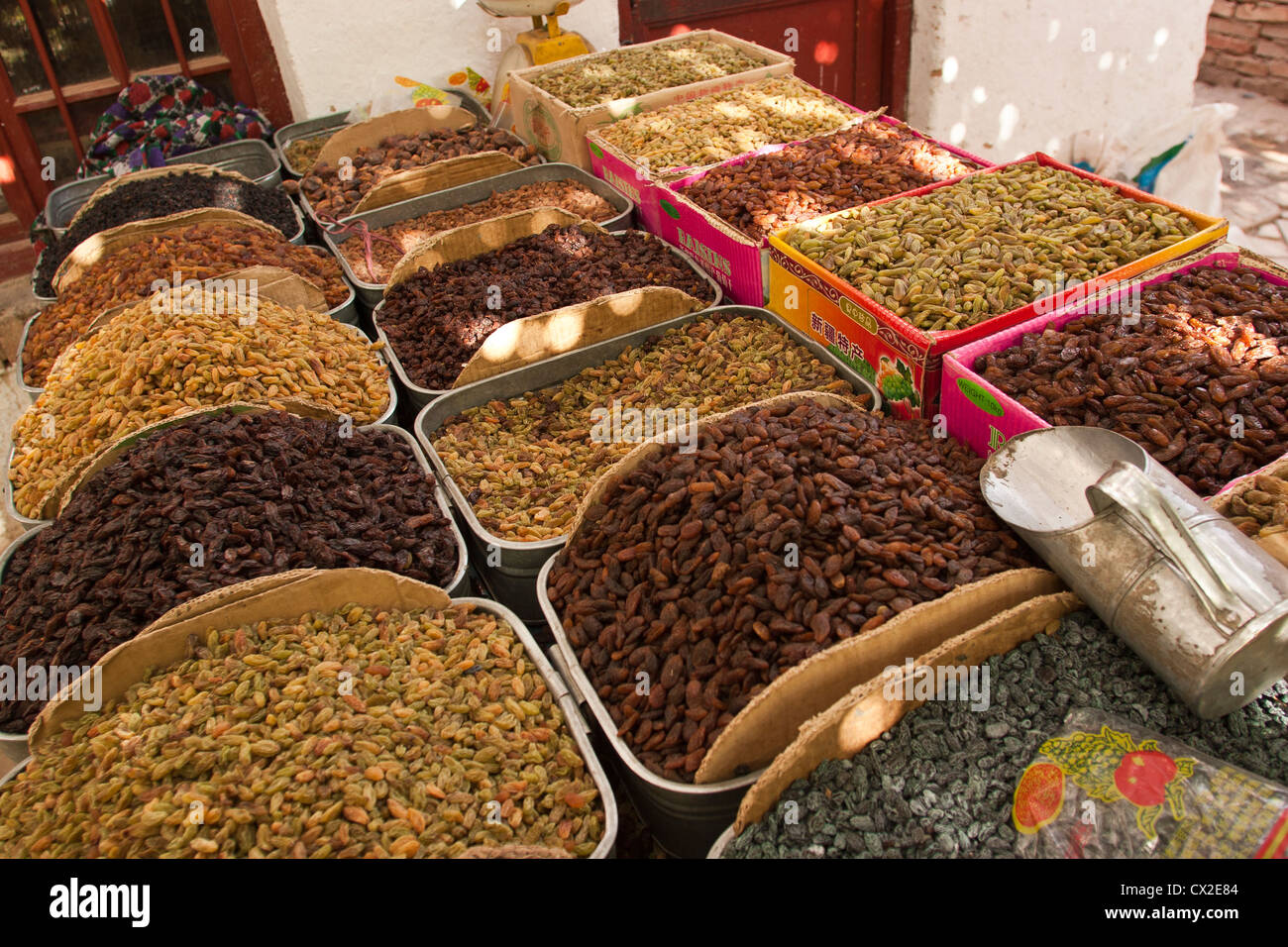 Different varieties of raisins for sale at a stall in Turpan, Xinjiang ...