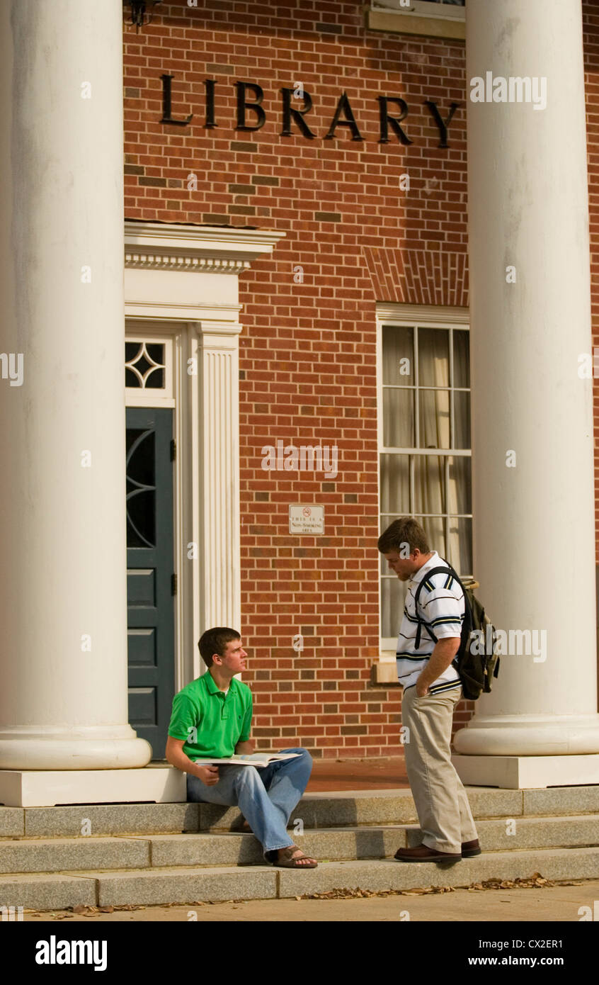 Two male college students talk on the steps of the library Stock Photo ...
