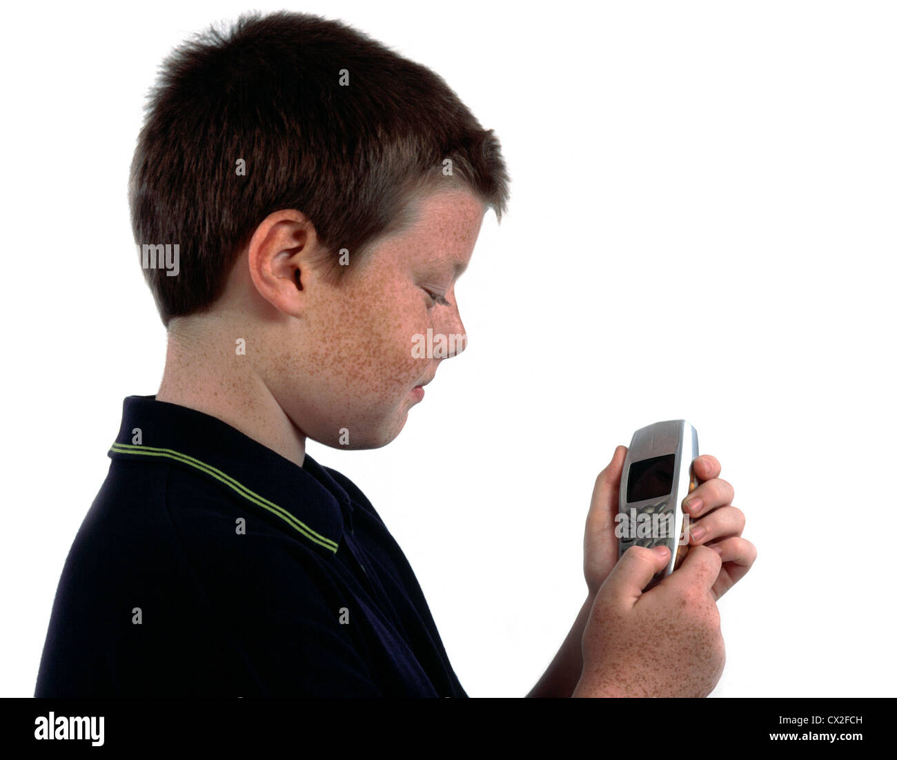Mobile phone being used by a young boy Stock Photo - Alamy