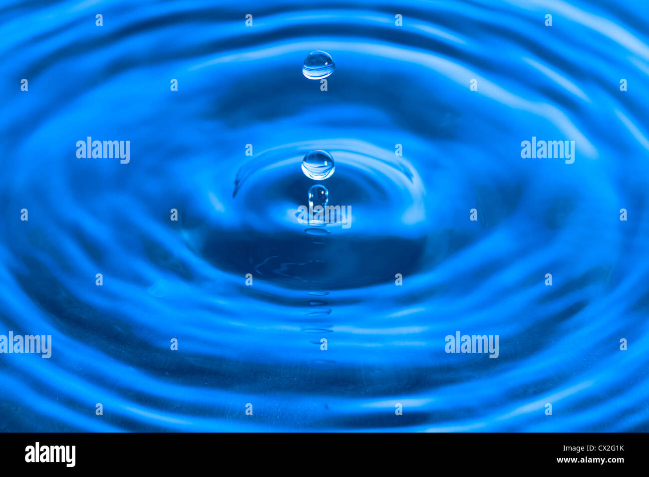 Water drop on liquid surface Stock Photo - Alamy