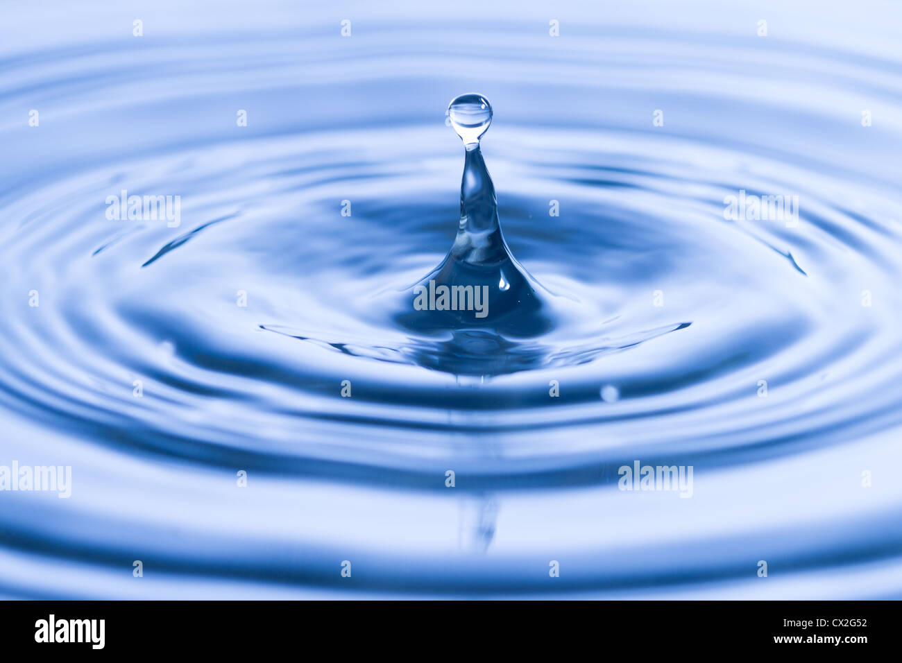 Water drop on liquid surface Stock Photo - Alamy