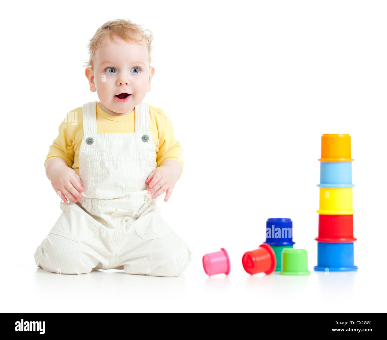 Cute little boy playing colorful toys isolated on white Stock Photo - Alamy
