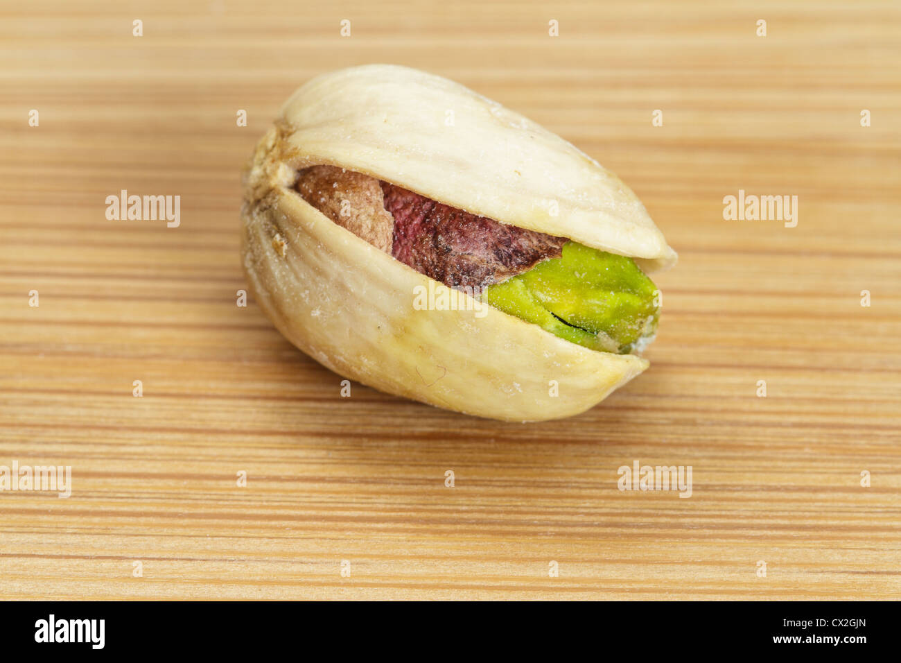 Pistachio nut on wooden board Stock Photo - Alamy