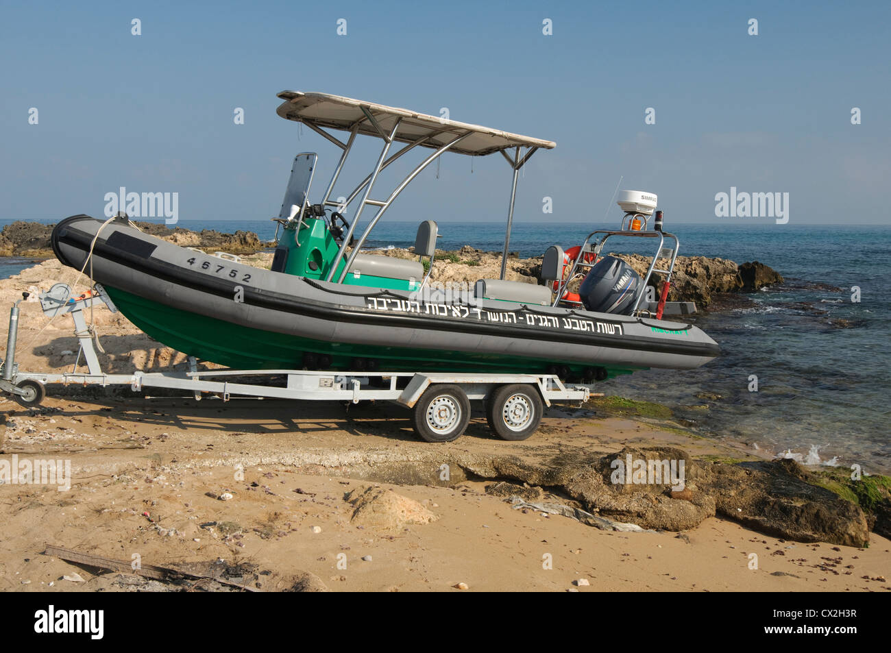 A RIB (Rigid hulled) inflatable boat is lowered into the Mediterranean ...