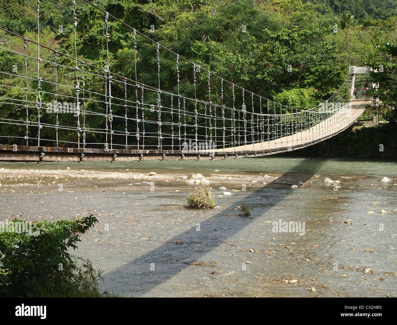 A suspension bridge over the river Stock Photo - Alamy
