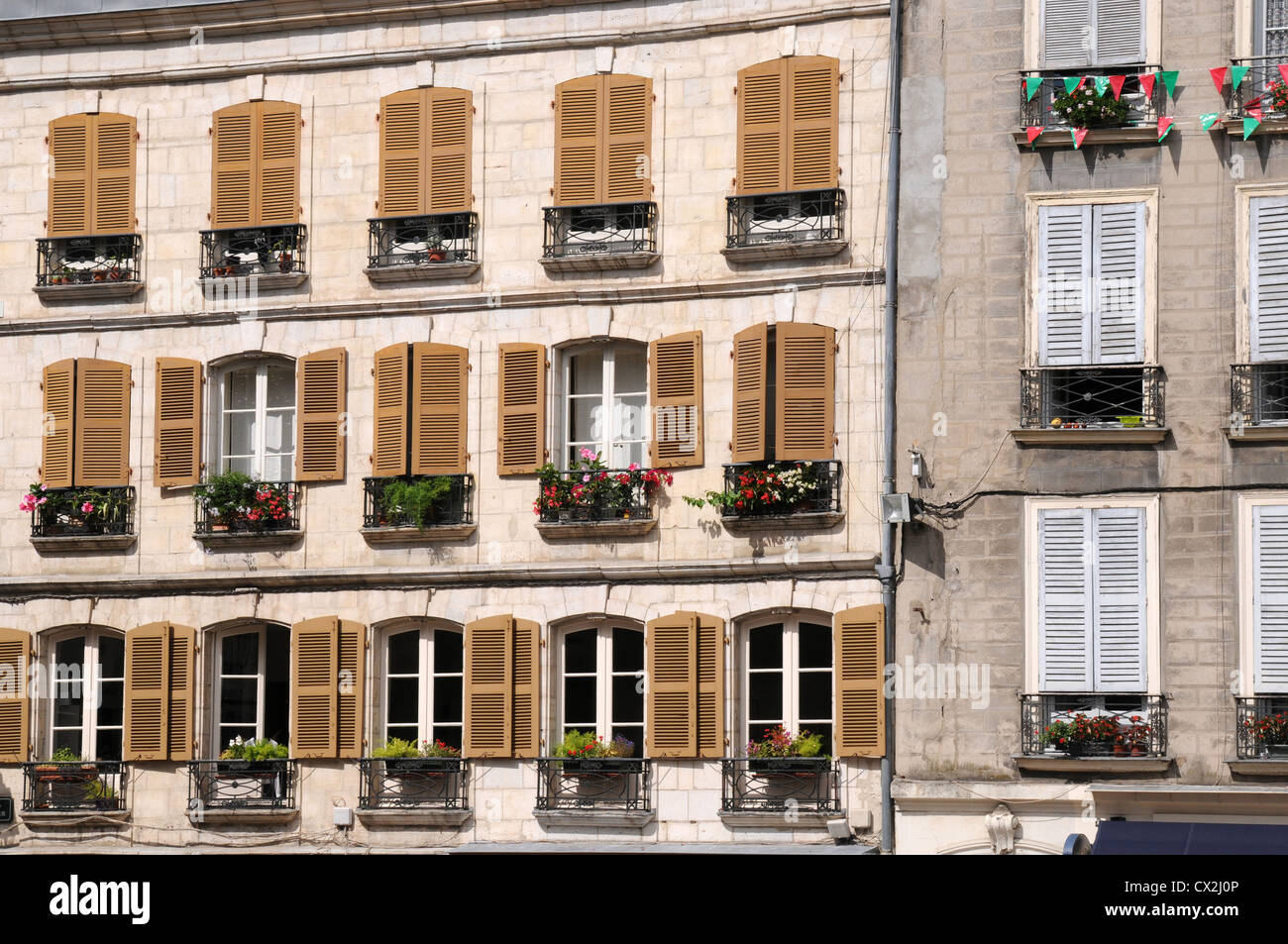 Street in Bayonne, France showing buildings with shuttered windows ...