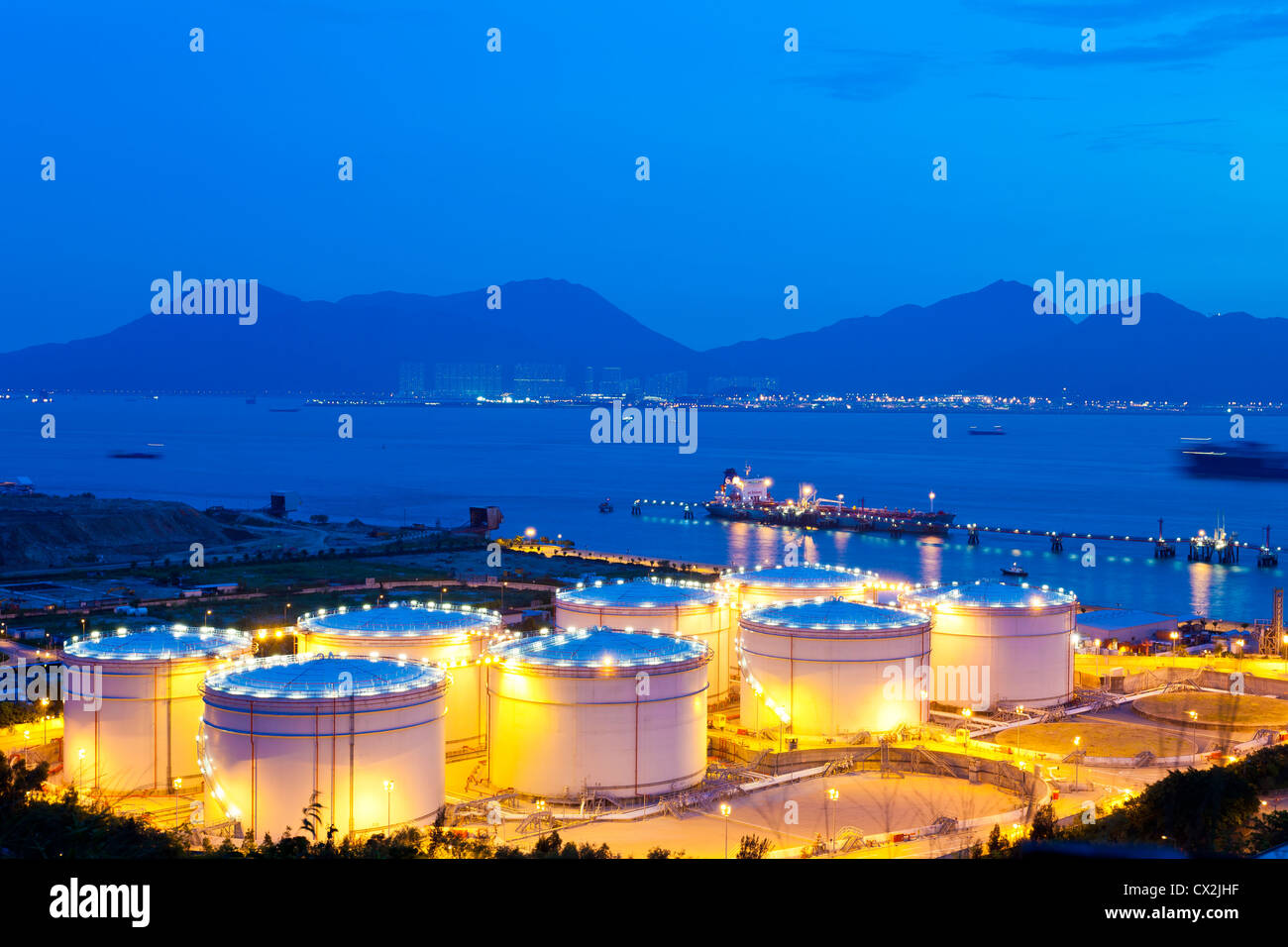 Oil tanks at night Stock Photo - Alamy