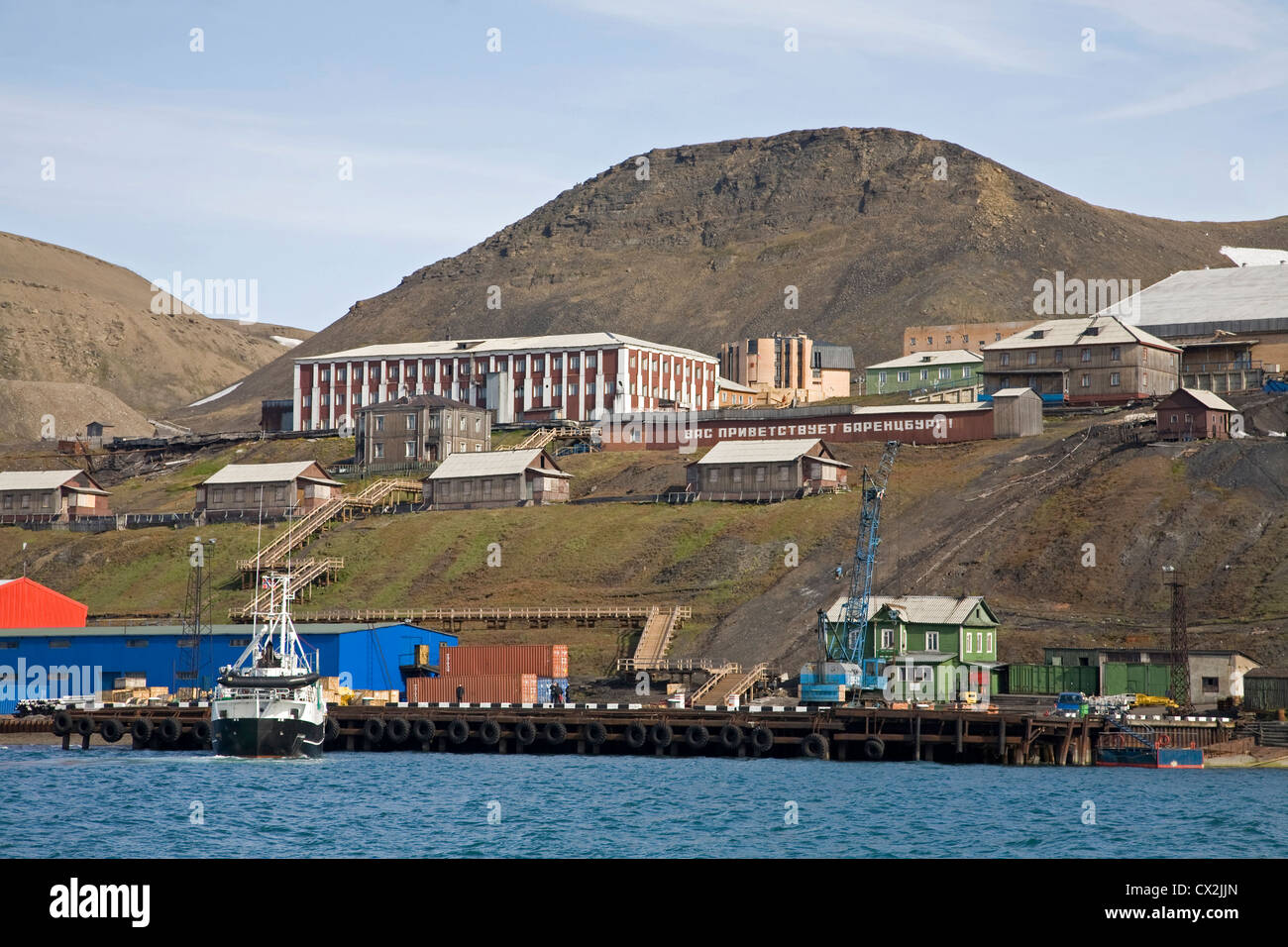 View over harbour and docks of the Russian mining town of Barentsburg, Svalbard, Spitsbergen ...