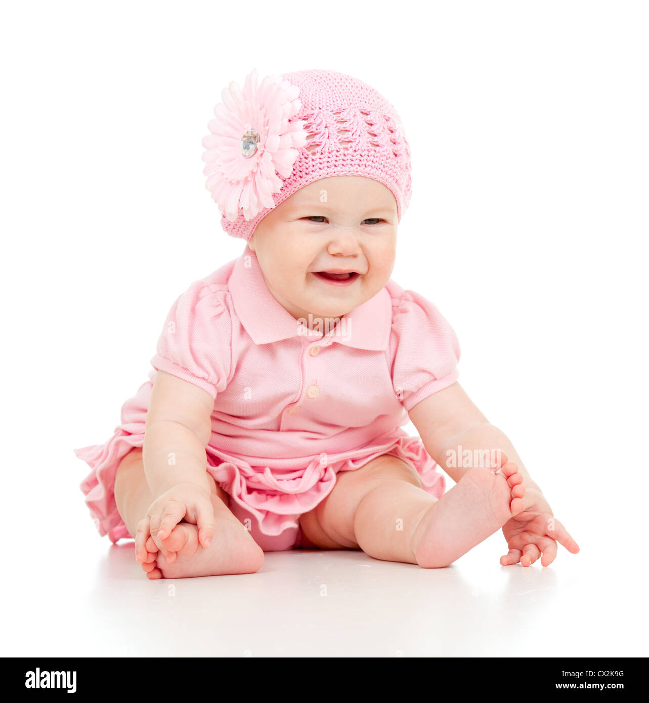 Little cute baby-girl in pink dress isolated Stock Photo - Alamy