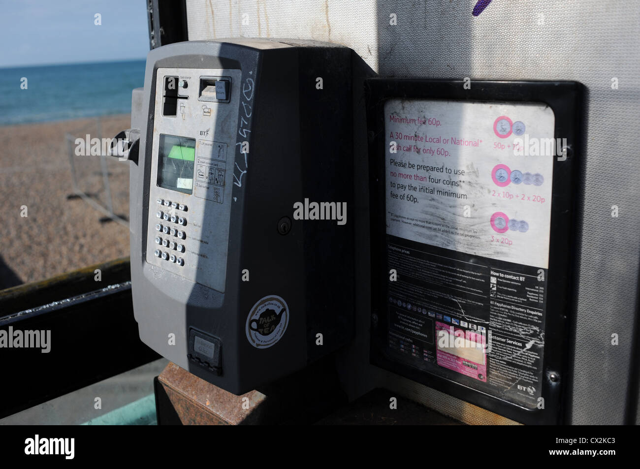 Broken and vandalised public telephone call box Brighton seafront UK ...