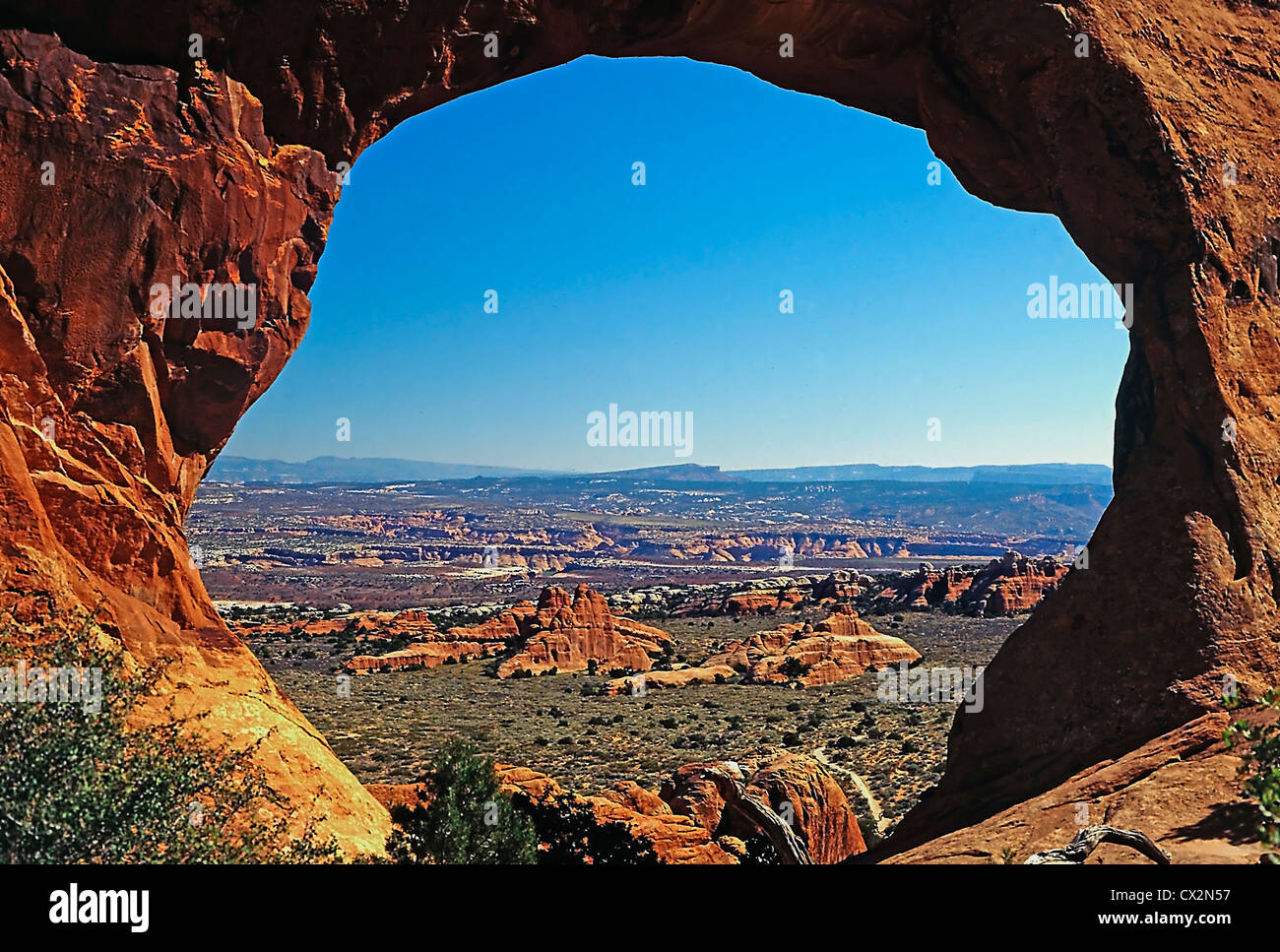 A view through the Moab Arch in Arches National Park, Utah Stock Photo ...