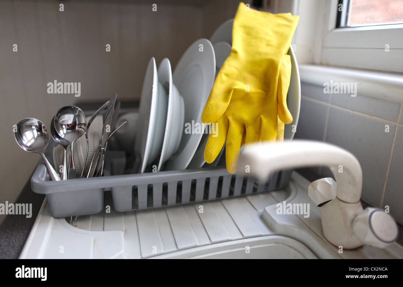 Drying Up on the draining board in a kitchen Stock Photo - Alamy