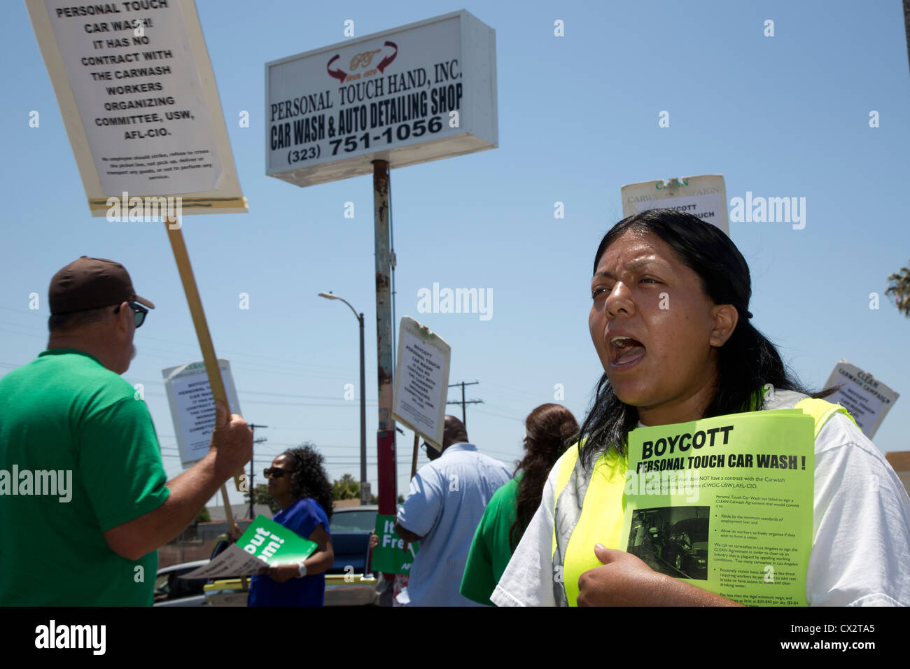 Supporters of a union organizing campaign picket a car wash in south ...