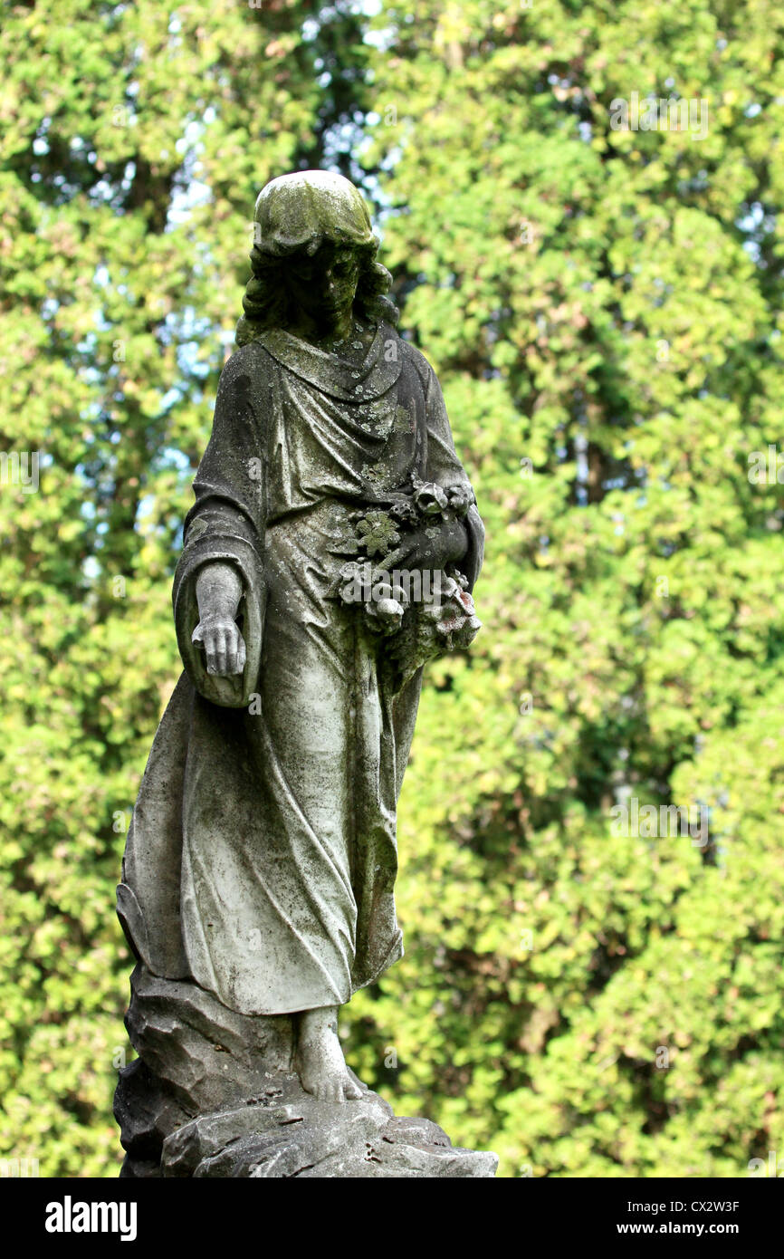 A religious statue with a backdrop of trees Stock Photo - Alamy