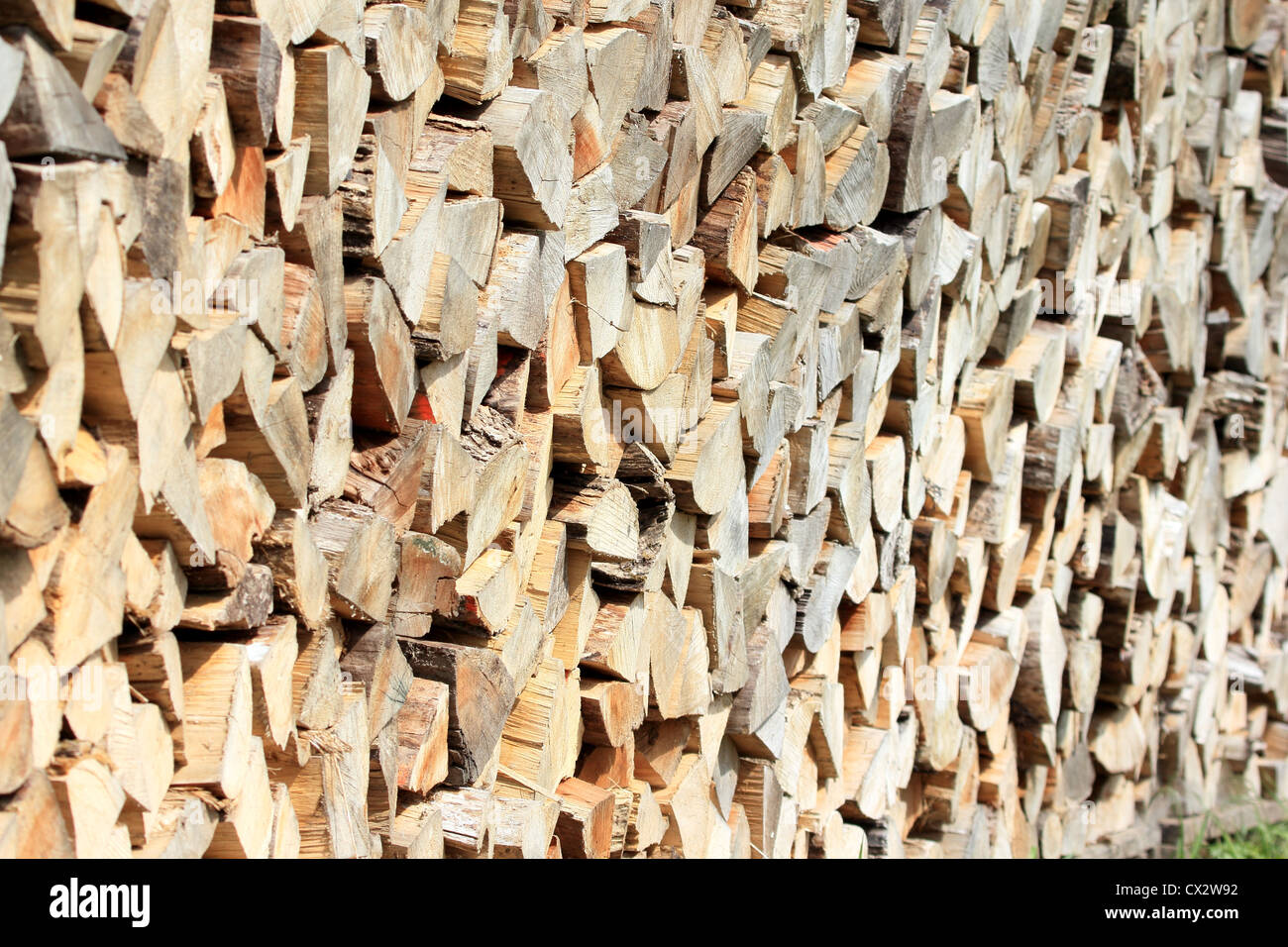A large stack of split firewood Stock Photo - Alamy