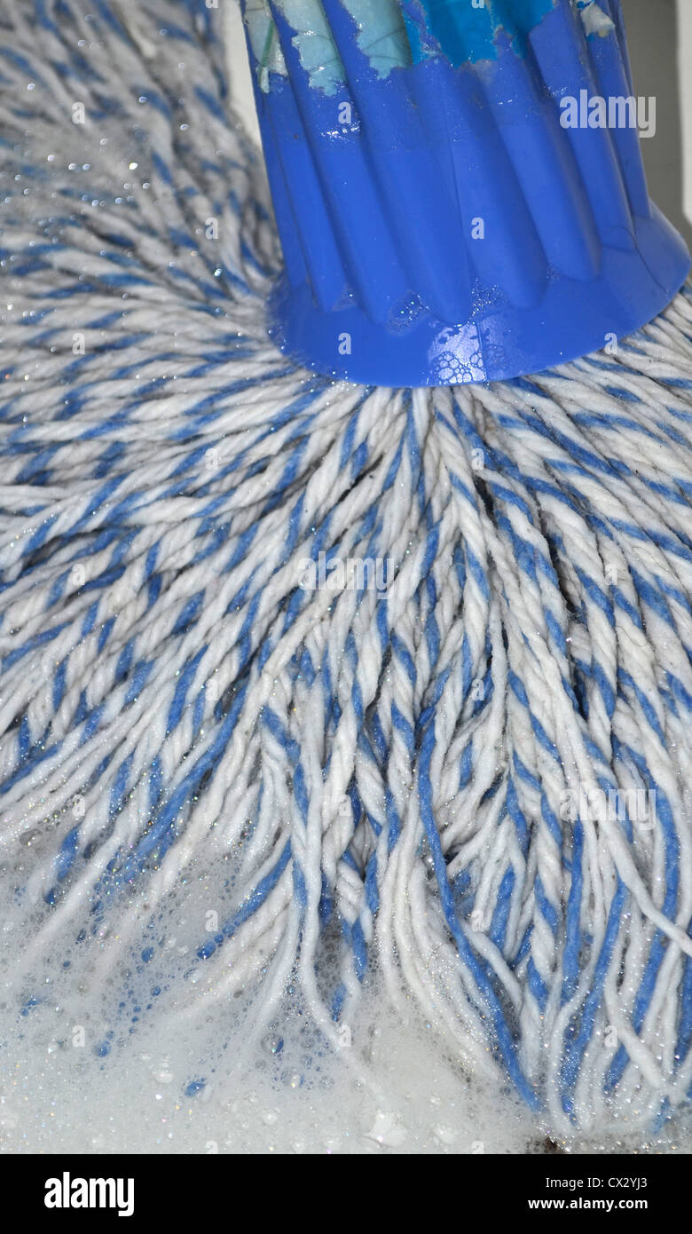 cleaning floor with a mop Stock Photo - Alamy