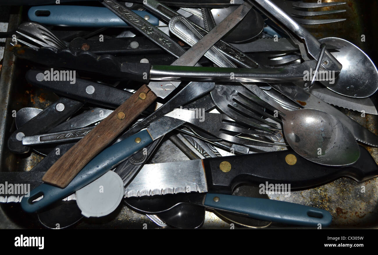 Dirty cutlery on tray Stock Photo - Alamy