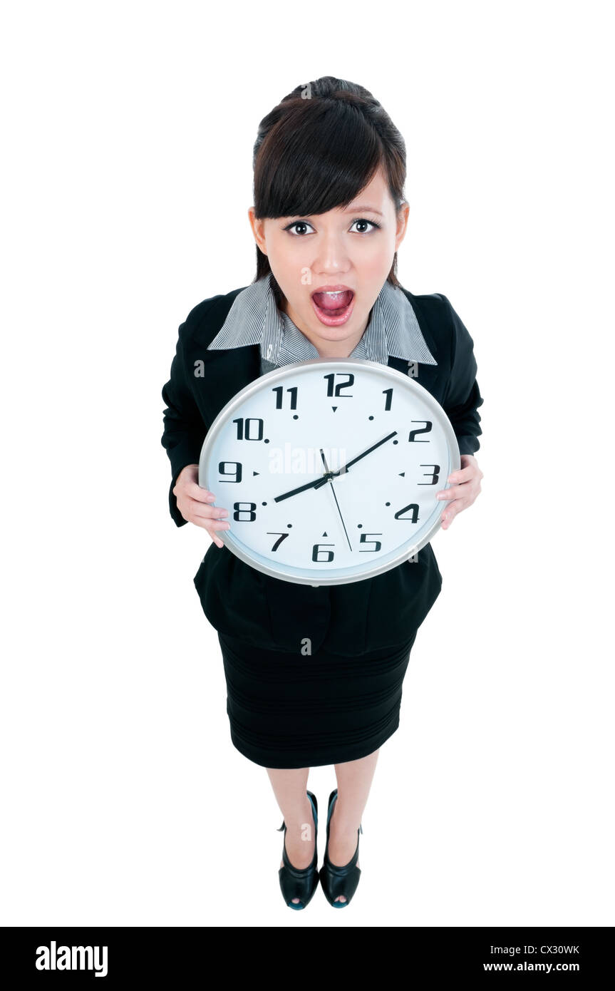 Attractive female executive holding a clock Stock Photo - Alamy Attractive female executive holding a clock Stock Photo - Alamy