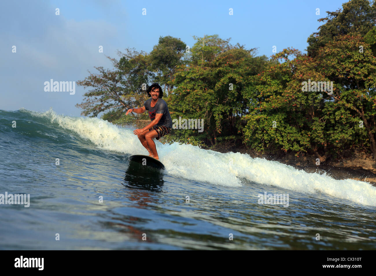 Skilled surfer on large waves hi-res stock photography and images - Alamy