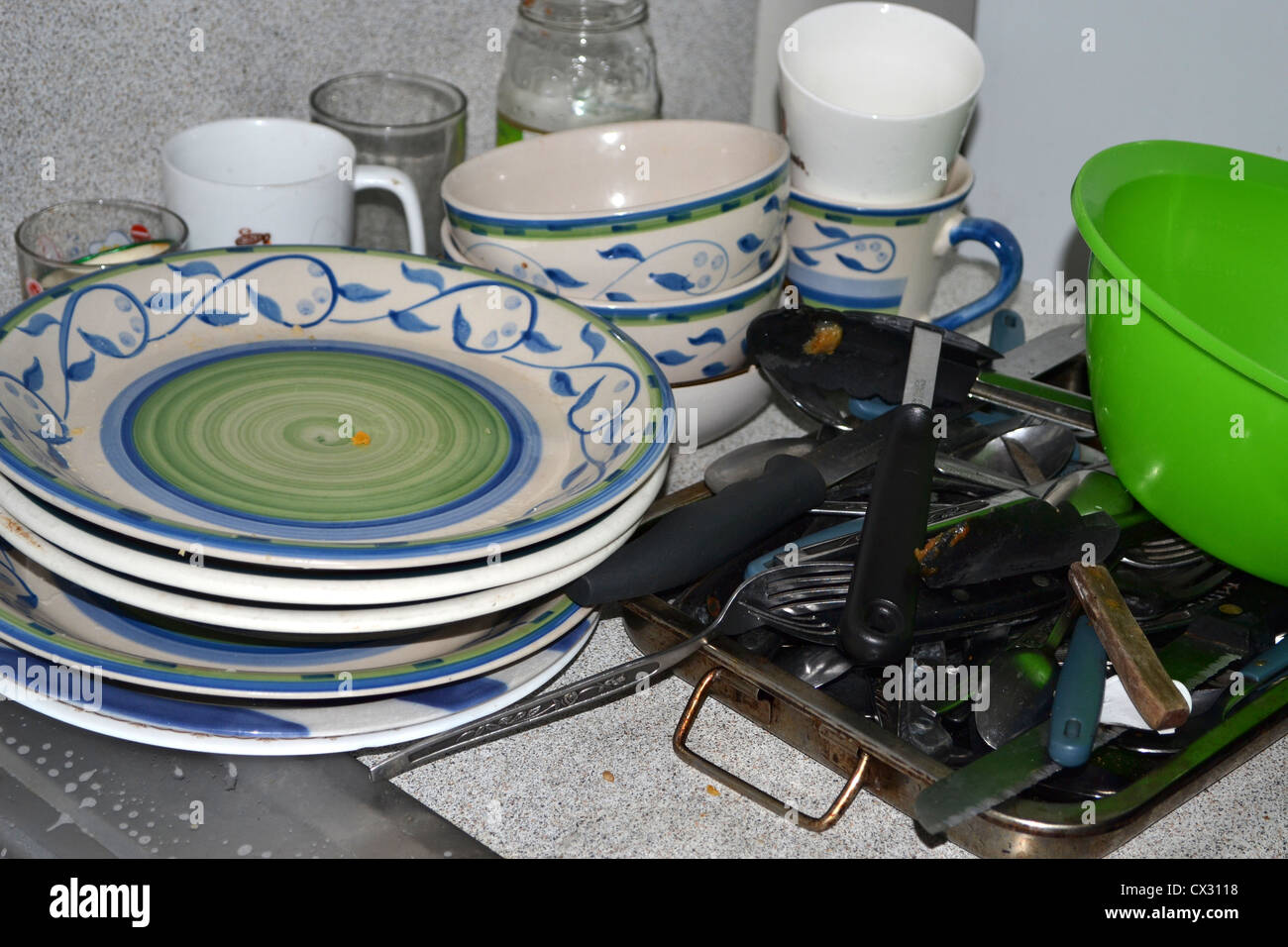 Stack of plates bowls and utensils hi-res stock photography and images ...