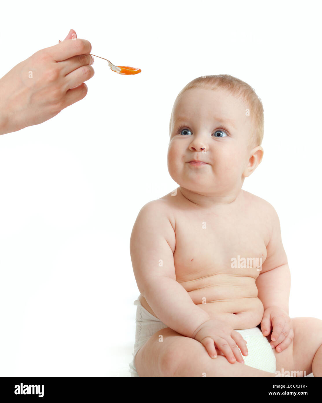 baby boy feeding isolated on white Stock Photo - Alamy
