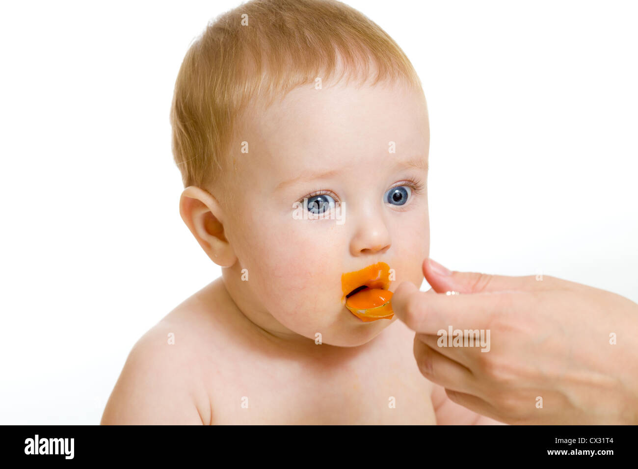 baby boy feeding isolated on white Stock Photo - Alamy