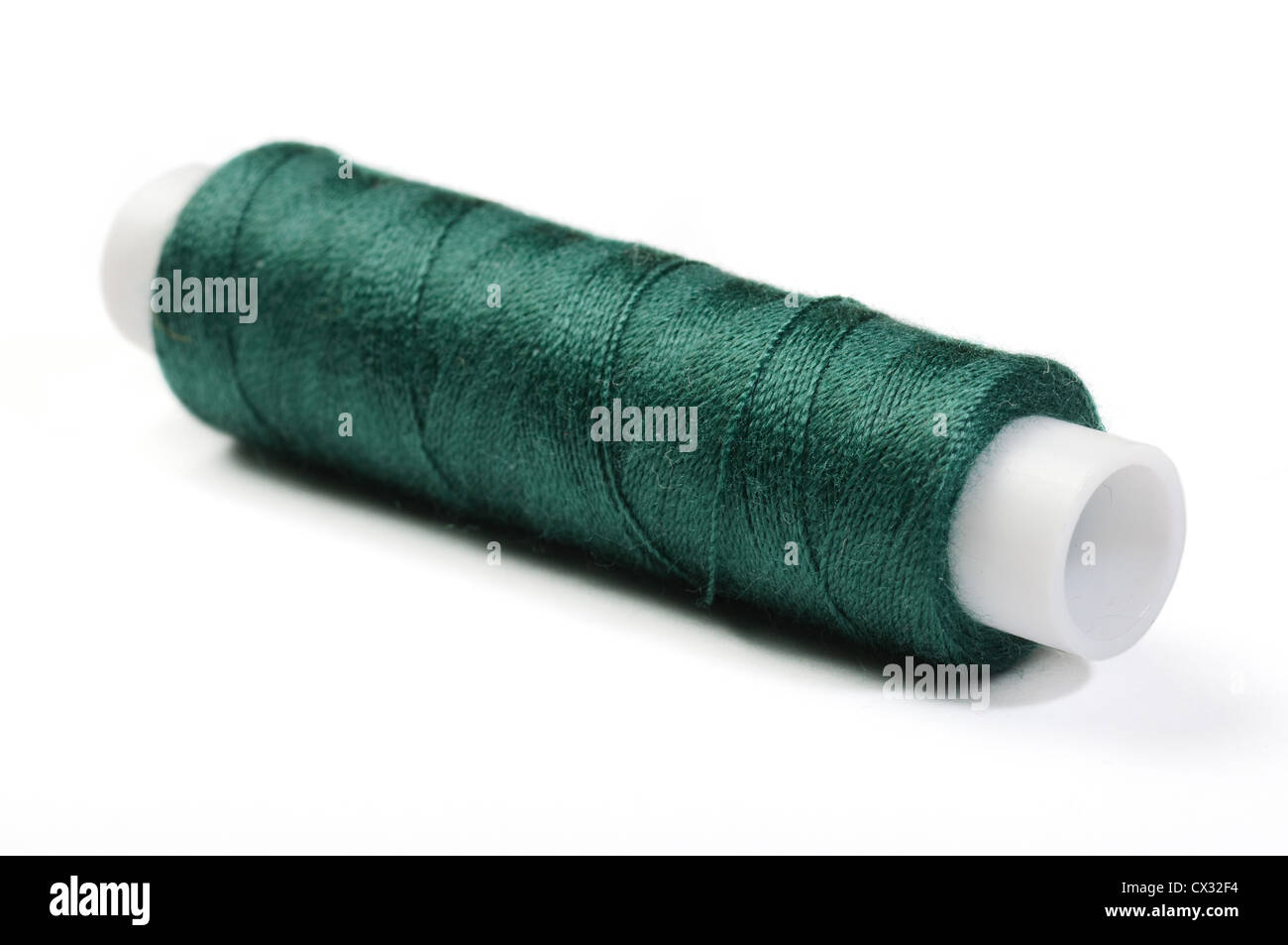 Hank of green thread isolated on a white background Stock Photo - Alamy