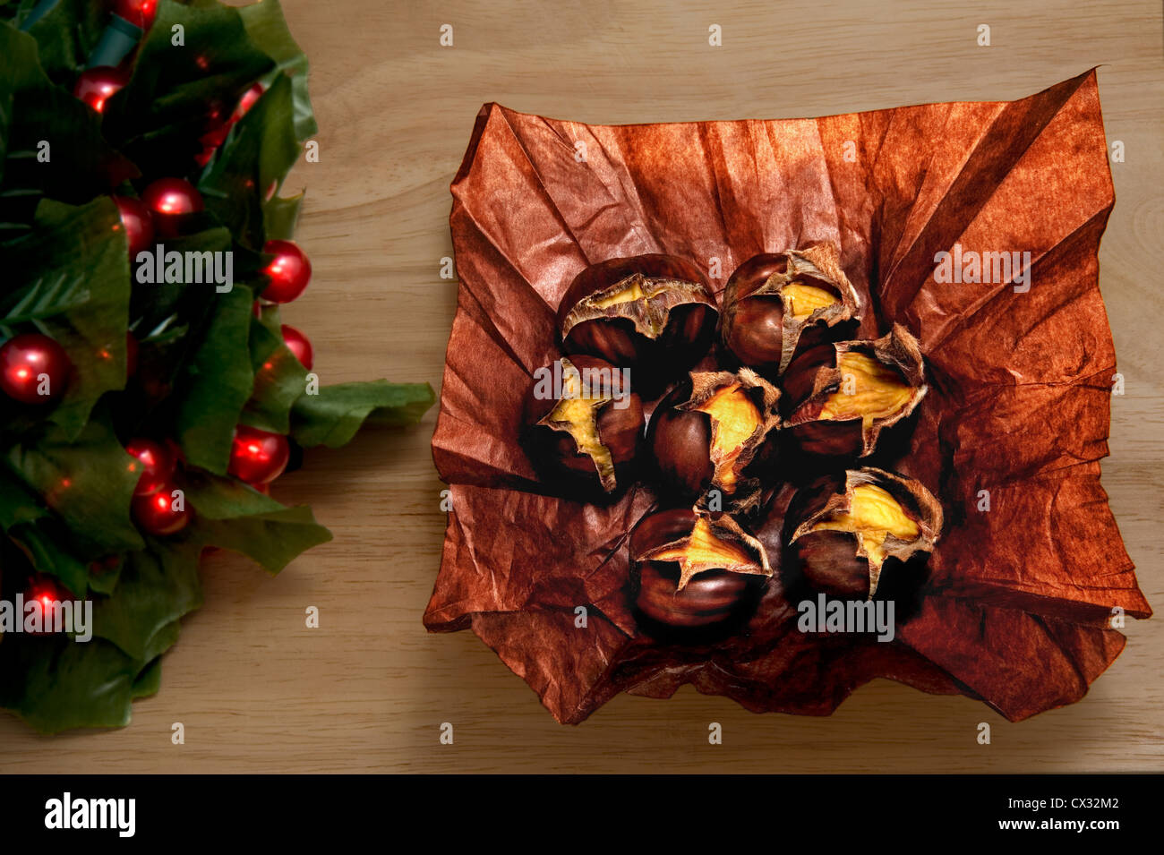Roasted chestnut, in a studio background, Christmas related Stock Photo - Alamy