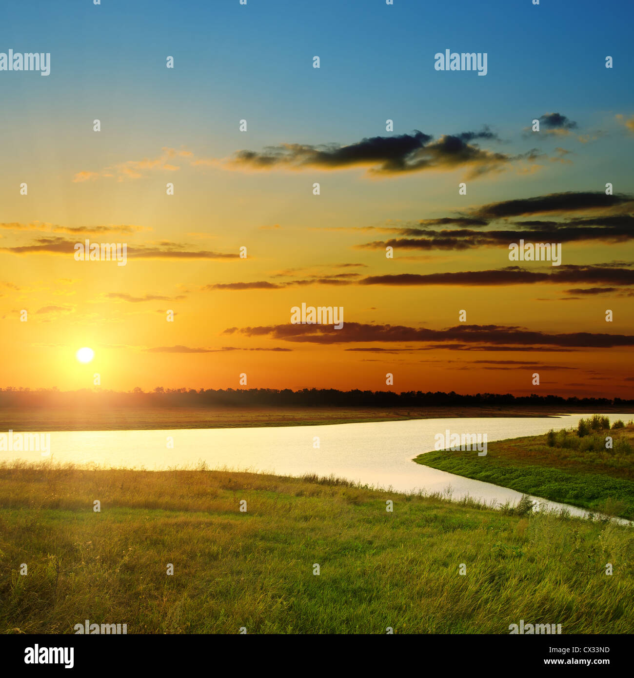 sunset over river Stock Photo - Alamy