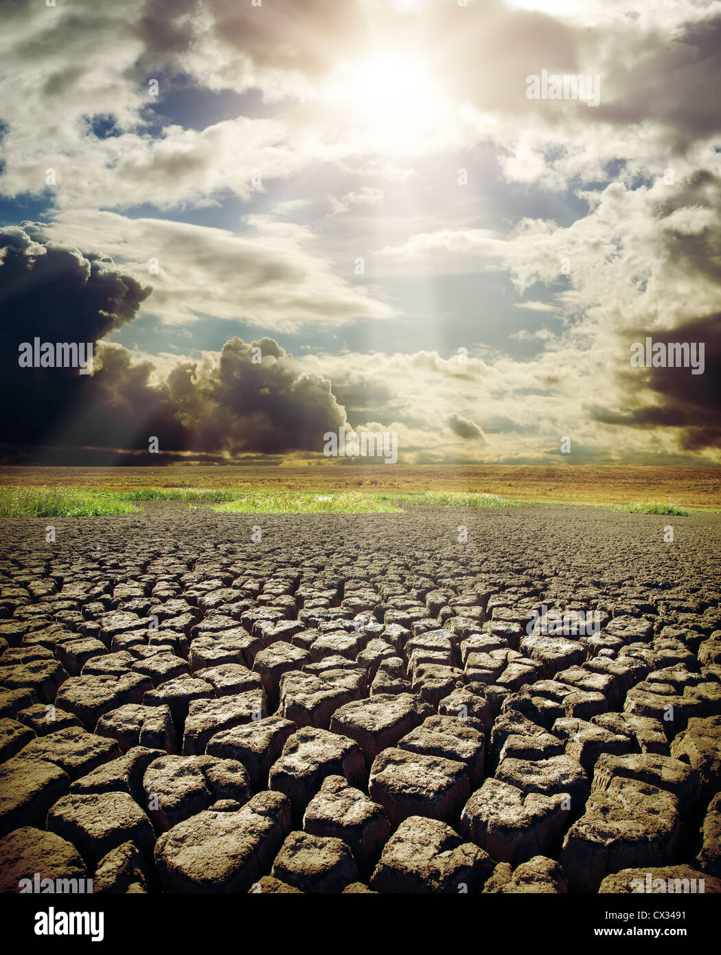 dry lake and dramatic sky with sun Stock Photo - Alamy