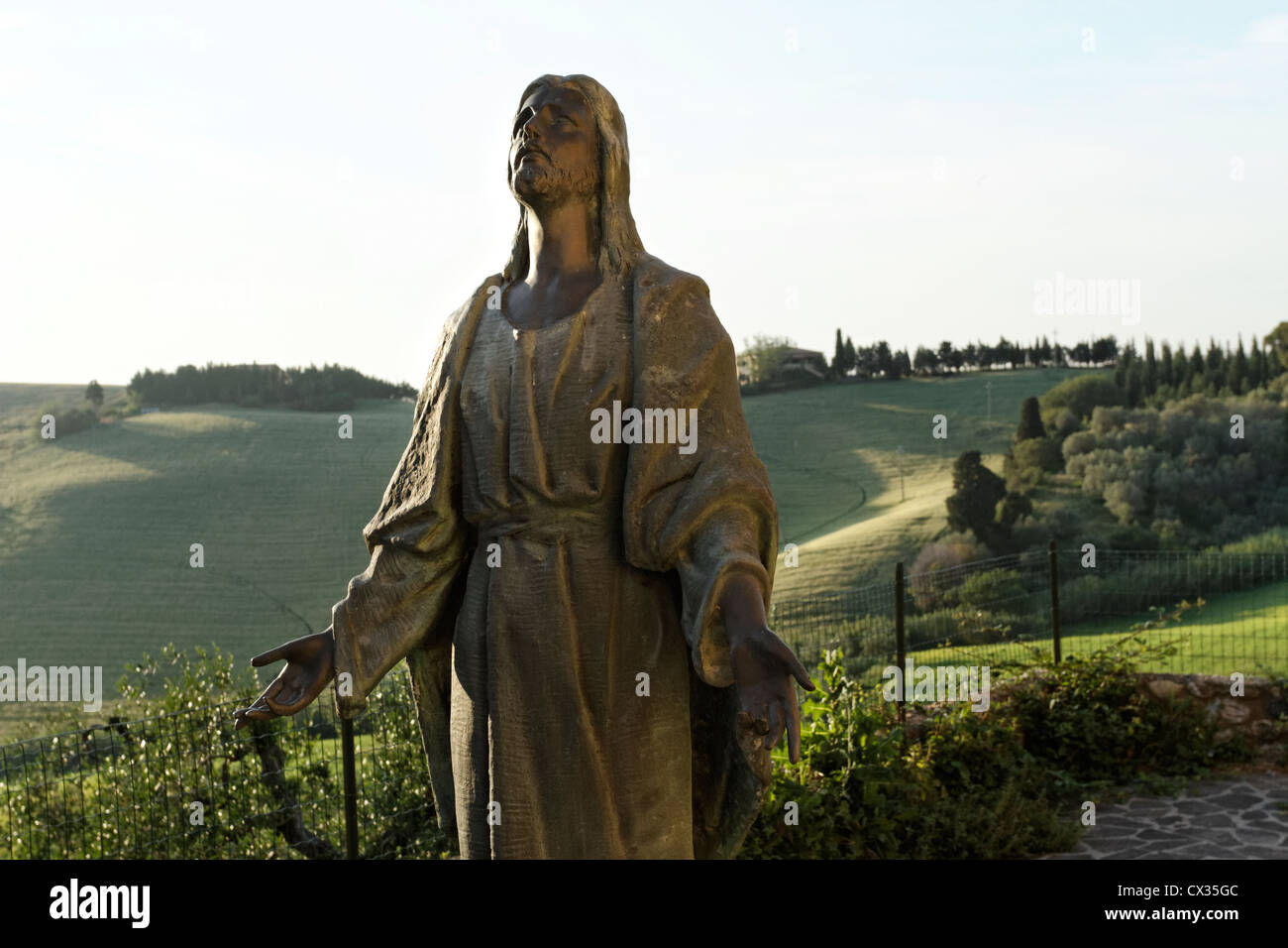 Statue of Jesus with Tuscan landscape, Castellina Marittima Tuscany ...