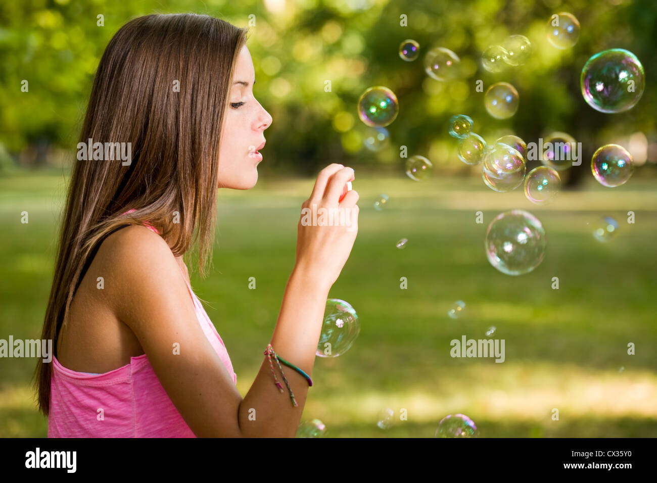 Free the bubbles, portrait of a beautiful young girl having fun ...
