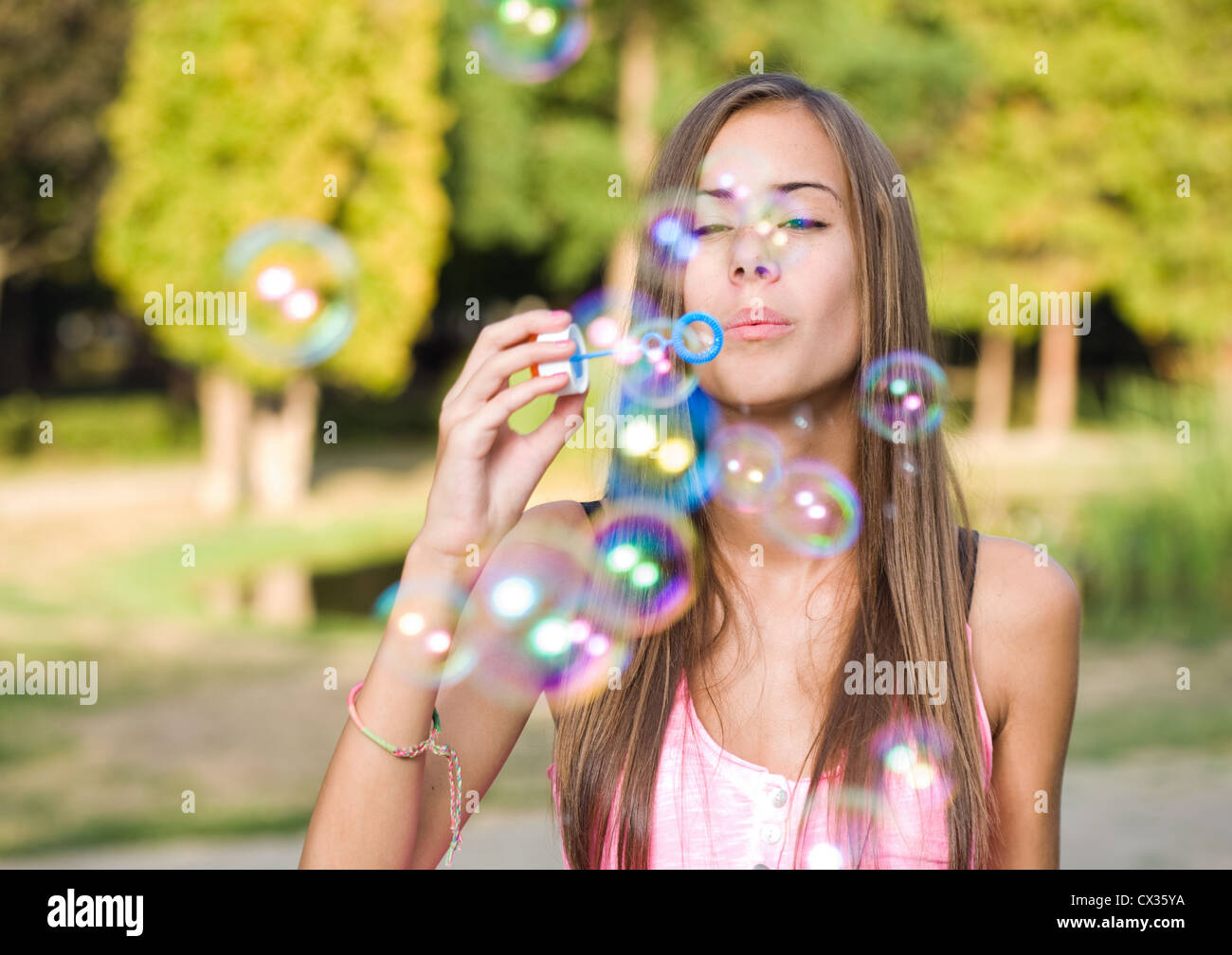 Free the bubbles, portrait of a beautiful young girl having fun ...