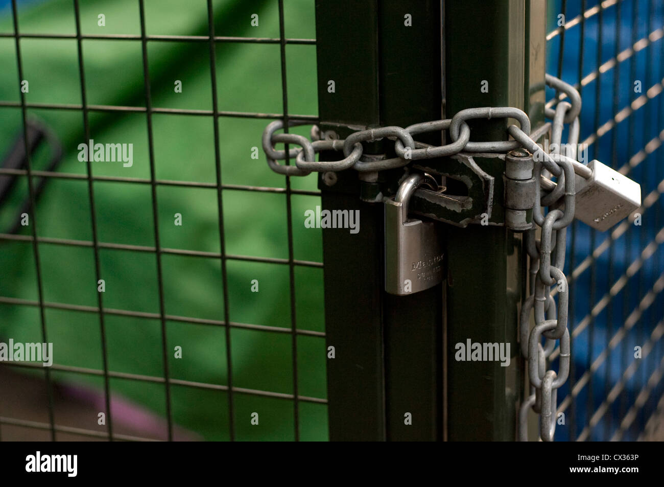 Metal gate padlocked and chained shut Stock Photo - Alamy