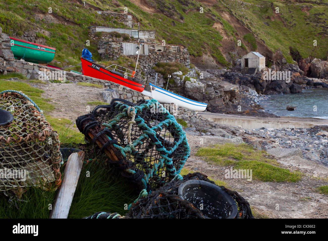 Fishing boats on the causeway at Priests Cove in Cornwall with crab or ...
