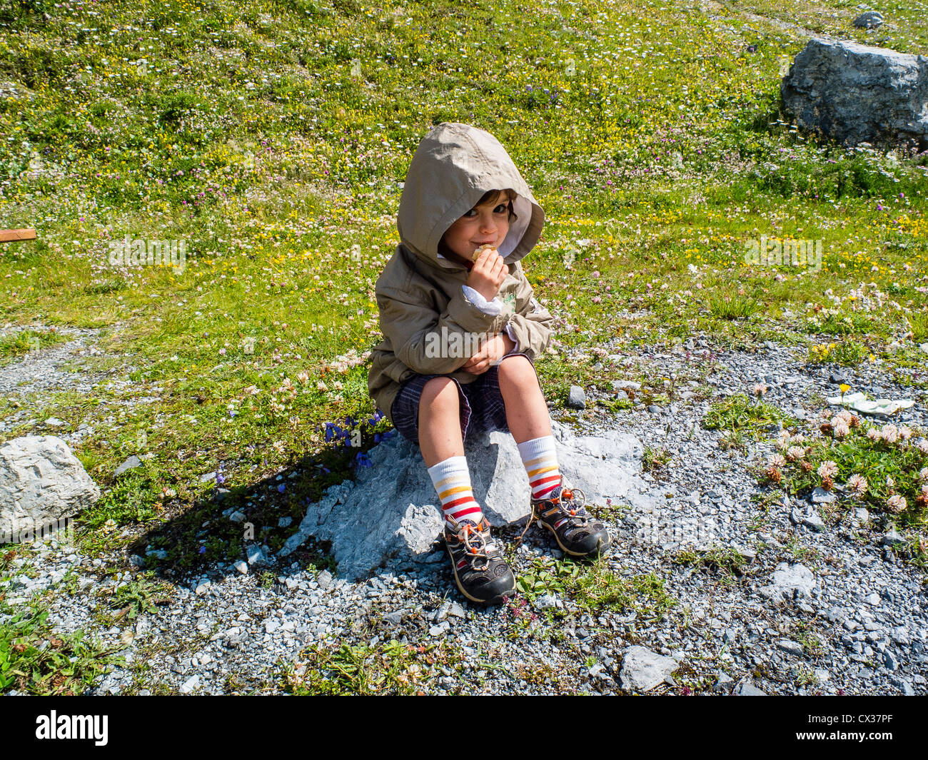 Children sitting on rock hi-res stock photography and images - Alamy