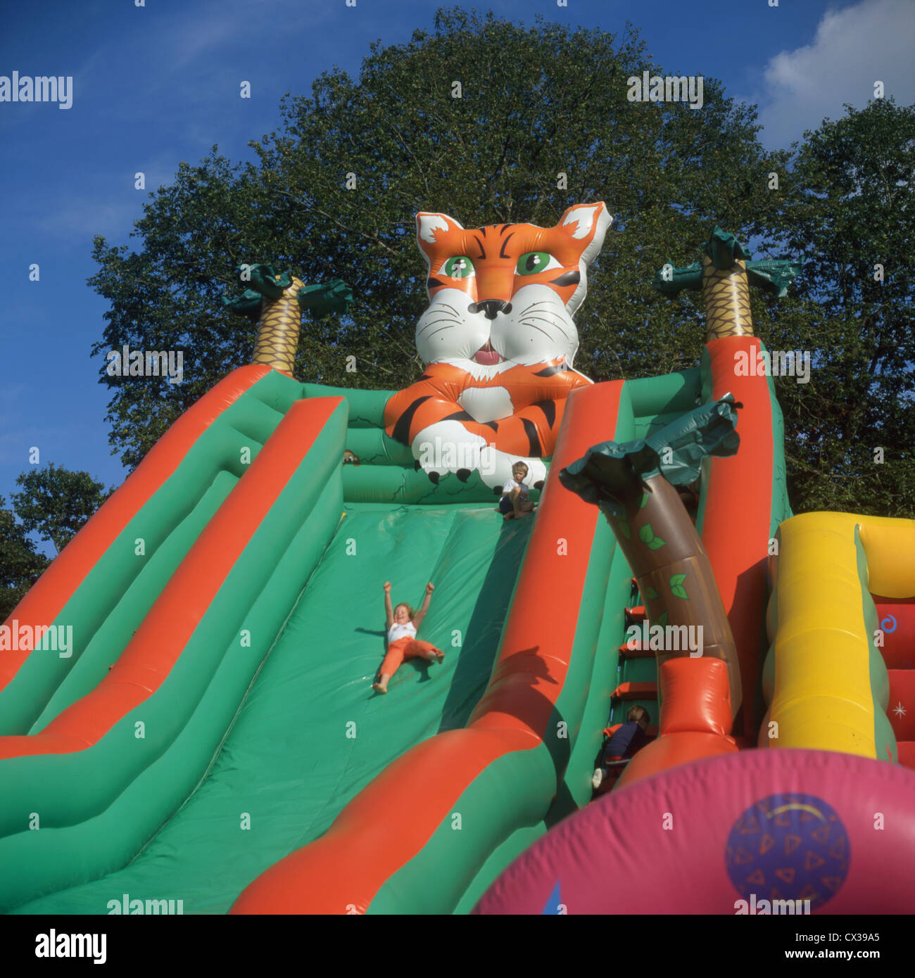 Inflatable castle with small child Stock Photo - Alamy