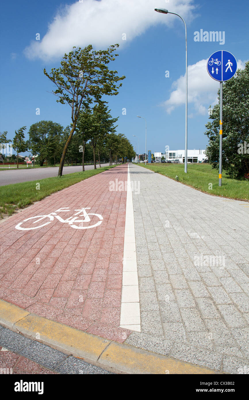 paved sidewalk with path for cyclists Stock Photo - Alamy