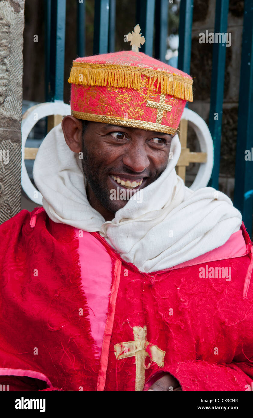 Addis Ababa Ethiopia Africa religious priest in red robe at Church of ...