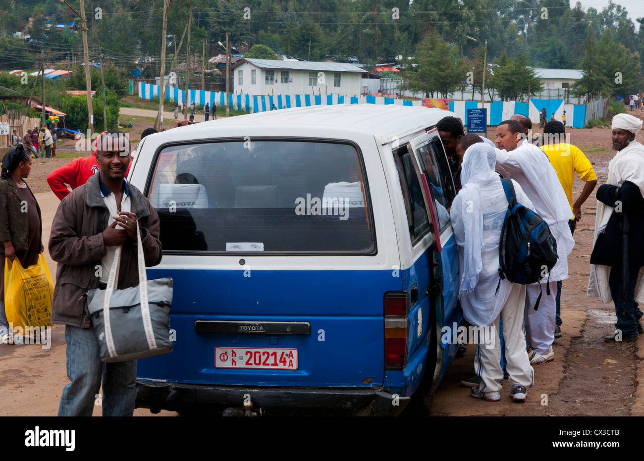 Addis Ababa Ethiopia Africa church people crowding into small van at ...