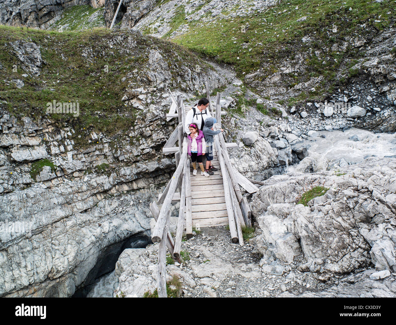 mother and children are hiking in the mountains, the Valley of the ...