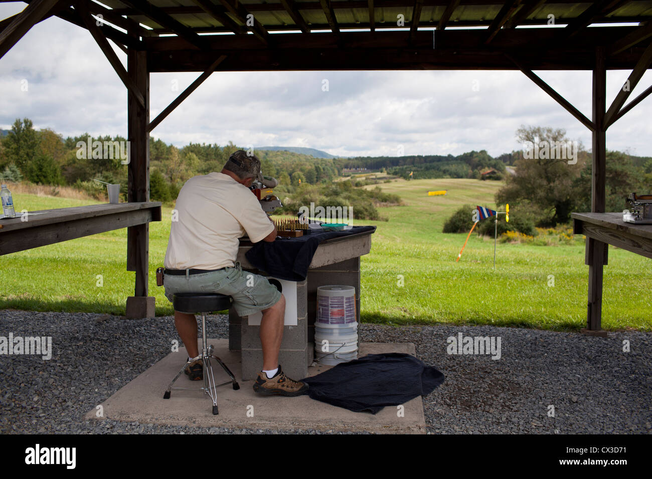 A benchrest shooter adjusts his .30 caliber custom made rifle at the ...