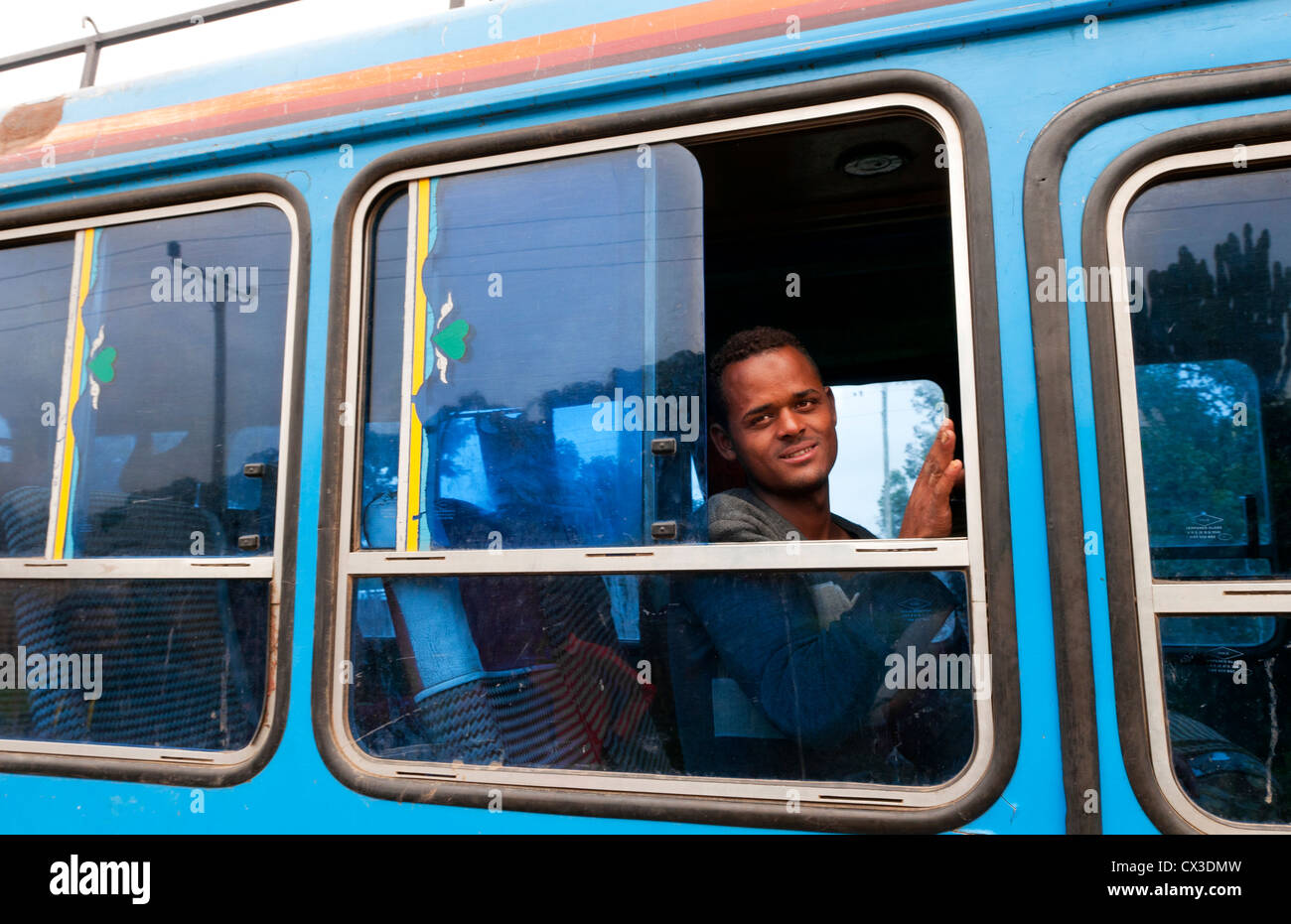 Shashemene Ethiopia Africa Oromo tribe young man on blue bus in window ...