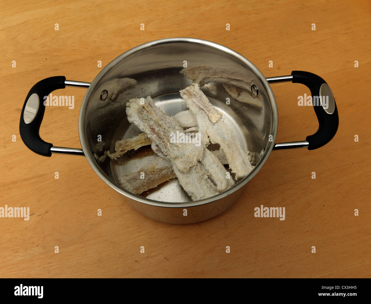 Boneless Saltfish Fillets In Boiling Pan Caribbean Food Stock Photo - Alamy