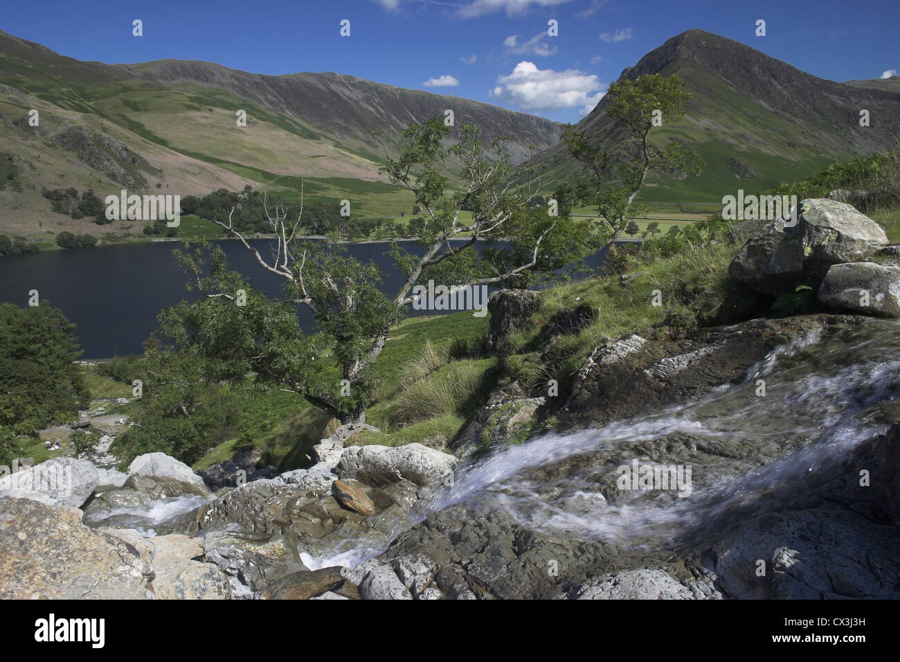 View of Buttermere Lake and waterfall Stock Photo - Alamy