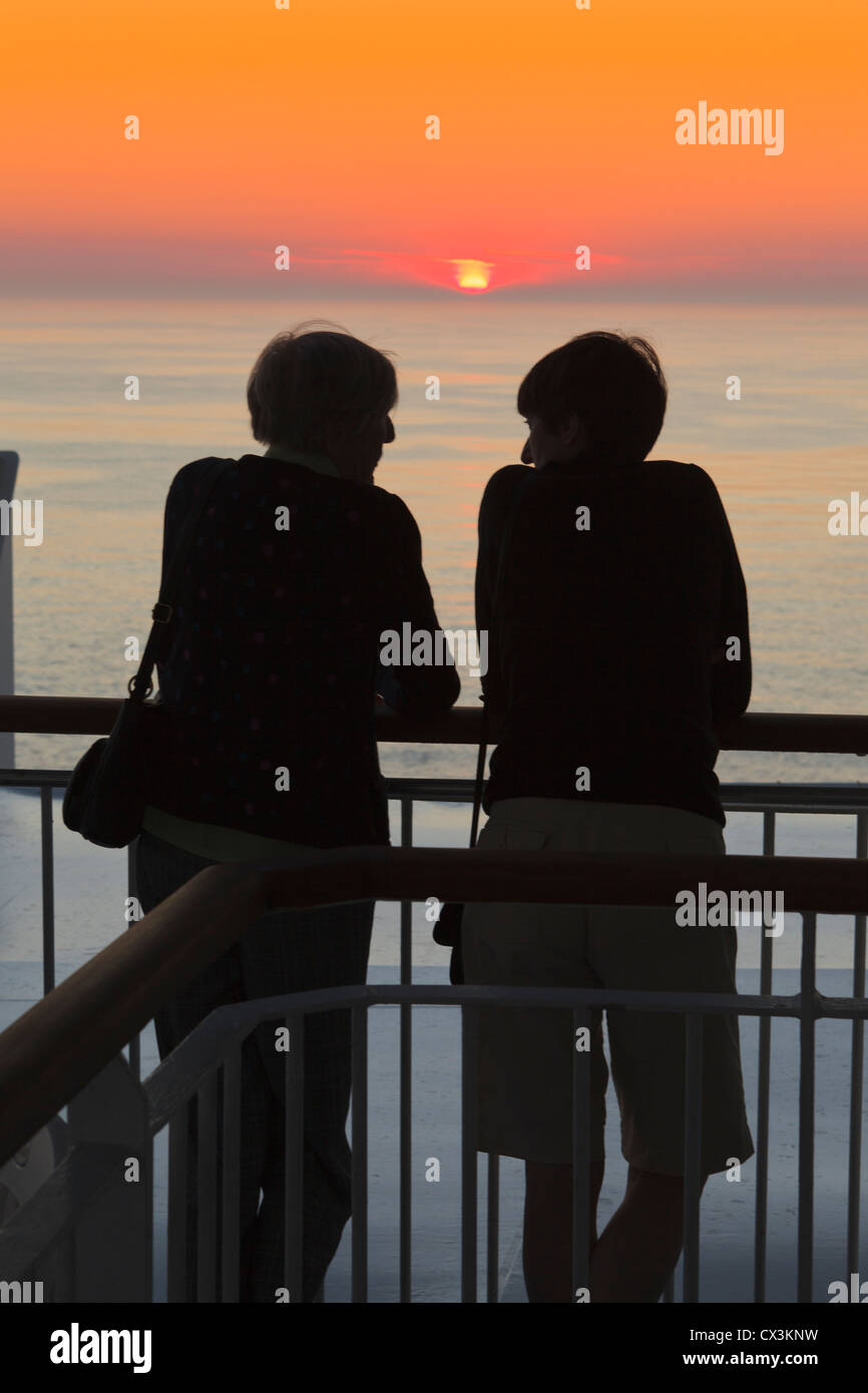 Sunset viewed from a boat at sea Stock Photo - Alamy