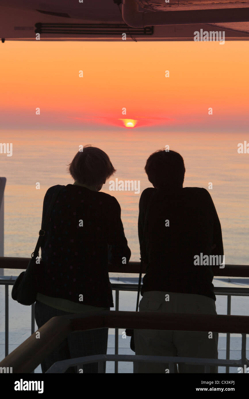 Sunset viewed from a boat at sea Stock Photo - Alamy