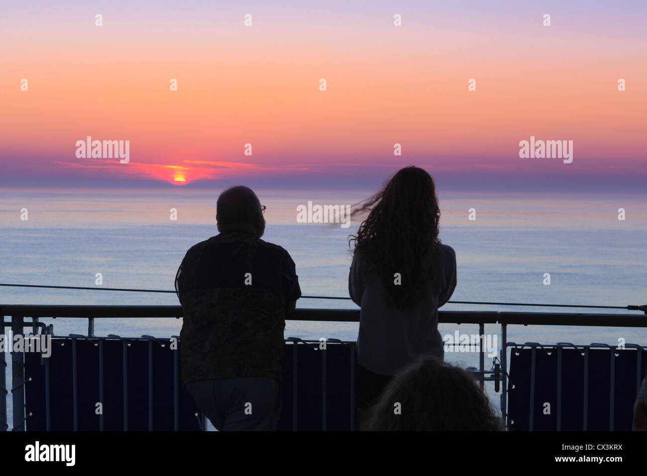 Sunset viewed from a boat at sea Stock Photo - Alamy